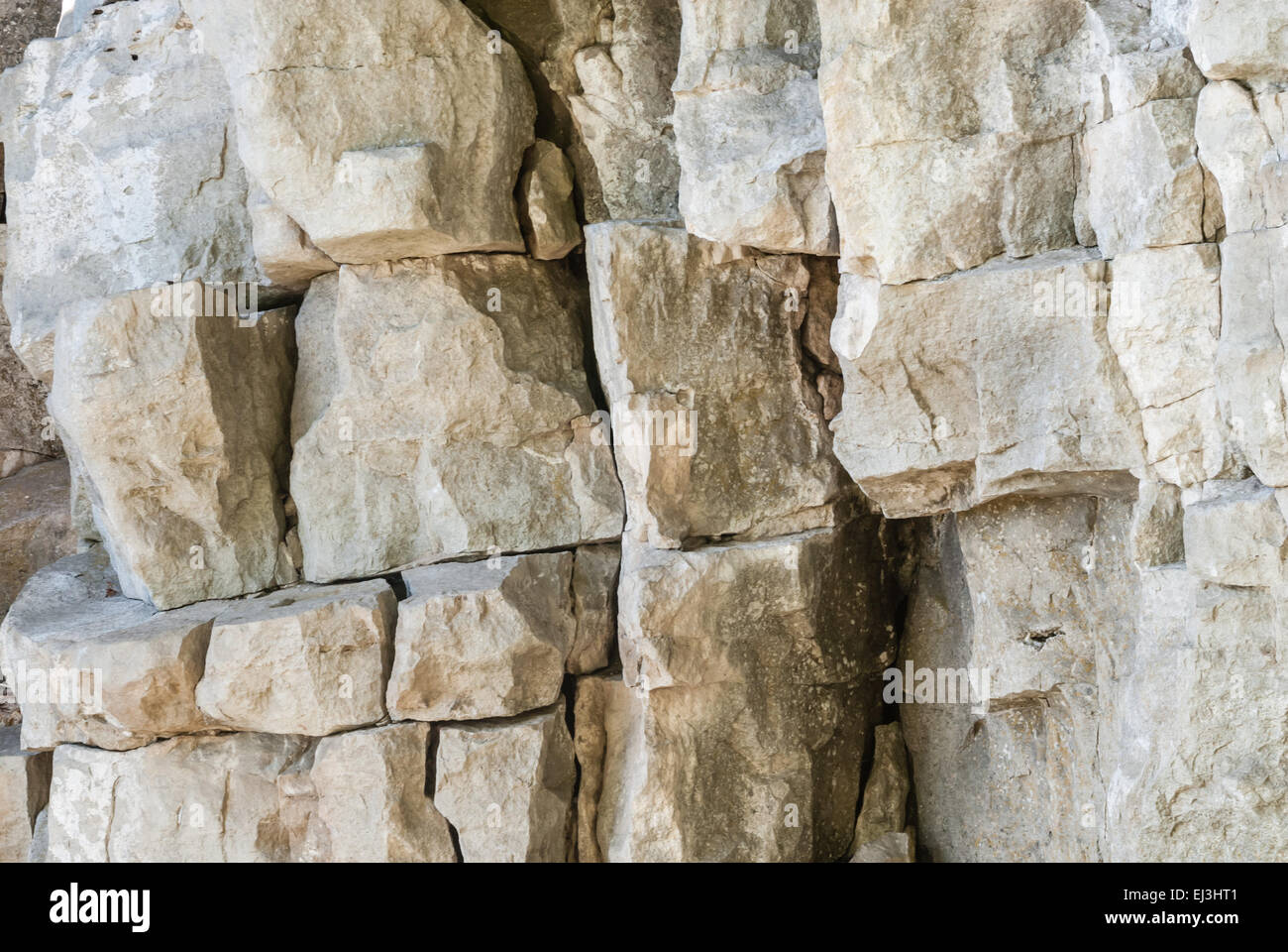 Grey stone cracked and weathered cliff face background texture Stock ...
