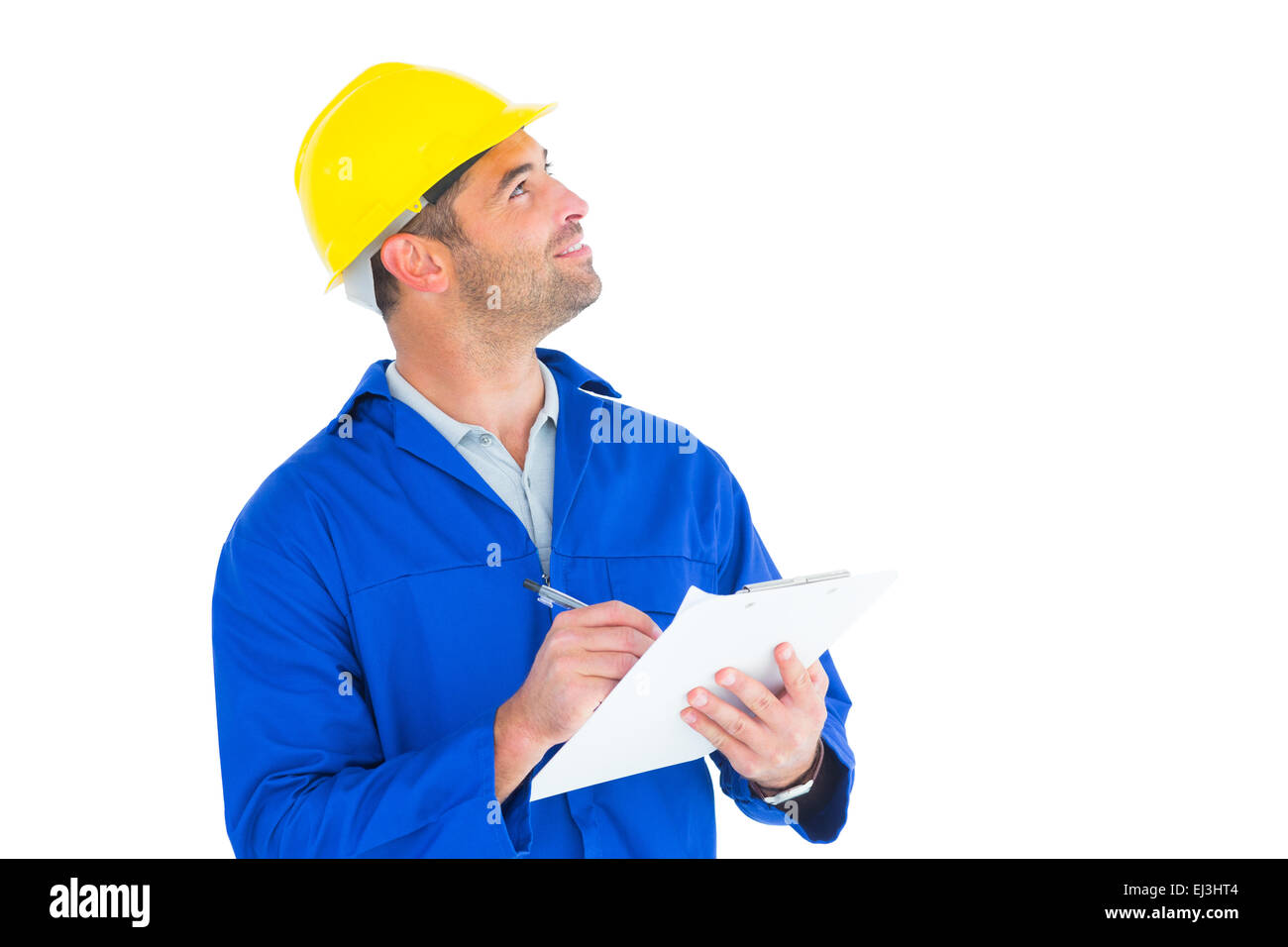Male supervisor looking up while writing on clipboard Stock Photo - Alamy