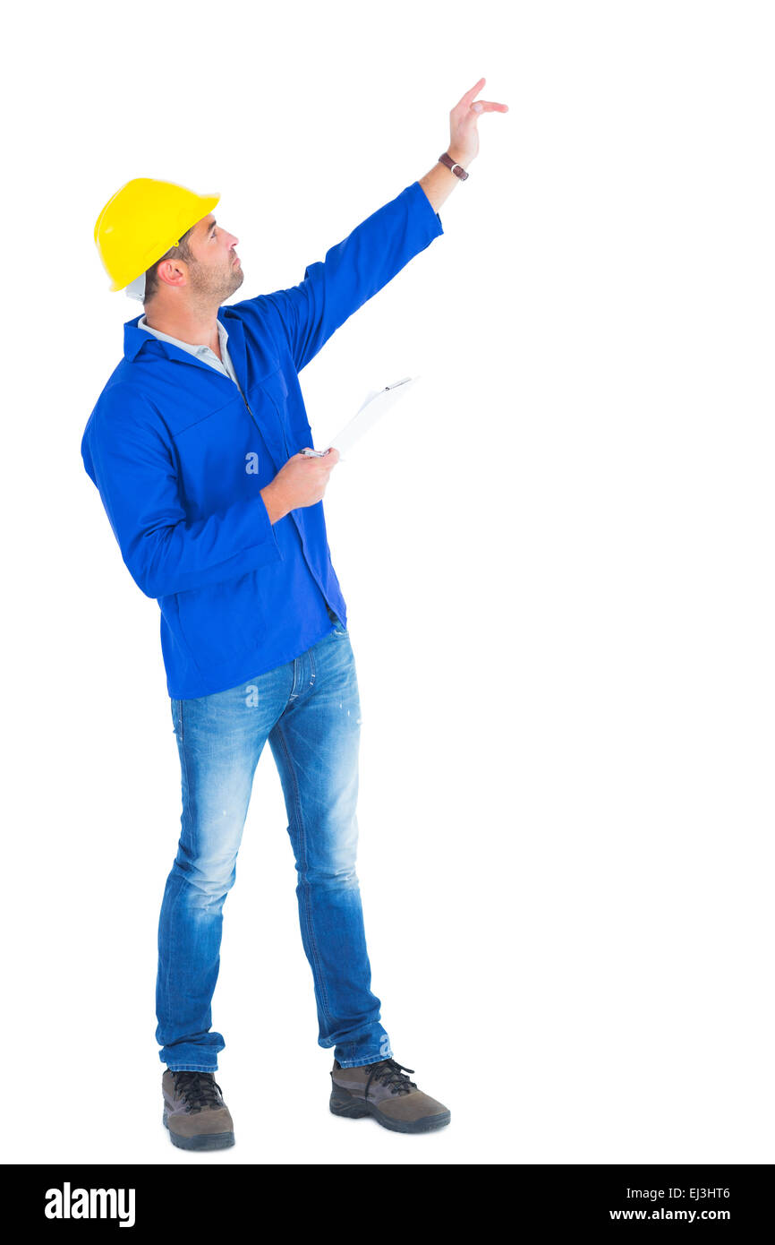 Supervisor with hand raised holding clipboard Stock Photo - Alamy