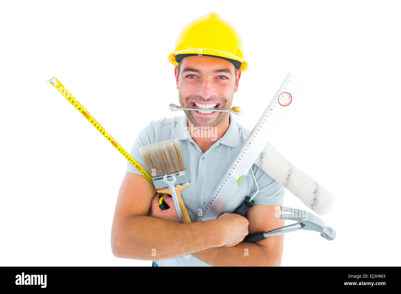 Portrait of smiling handyman holding various tools Stock Photo - Alamy