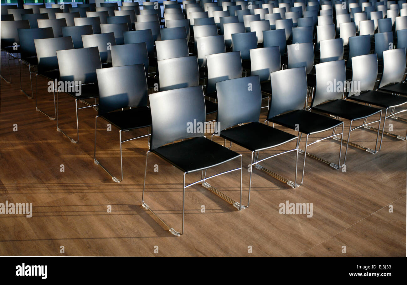 Rows of empty chairs prepared for an indoor event Stock Photo - Alamy