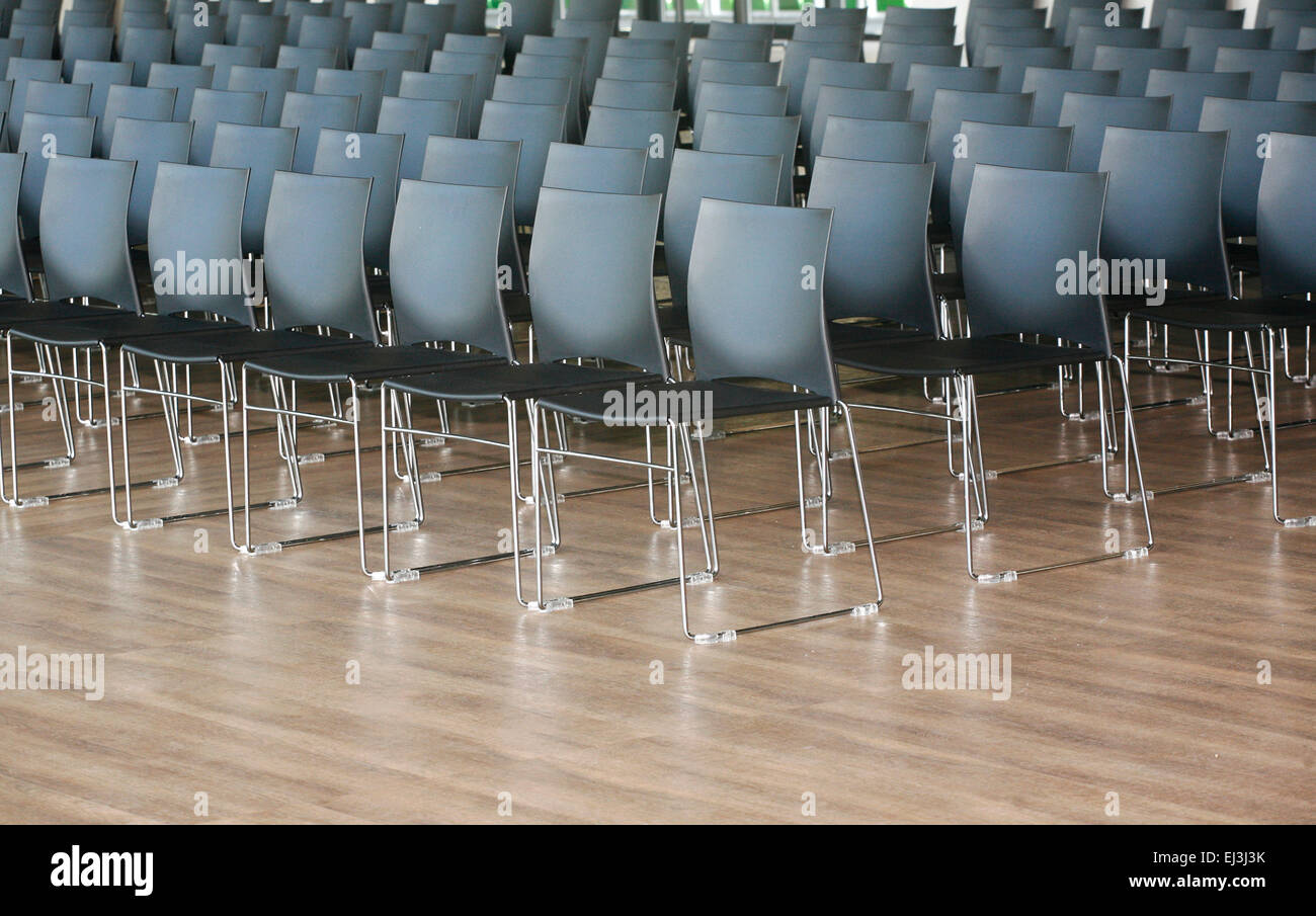 Rows of empty chairs prepared for an indoor event Stock Photo - Alamy