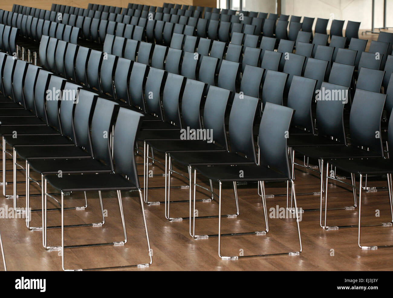 Rows of empty chairs prepared for an indoor event Stock Photo - Alamy