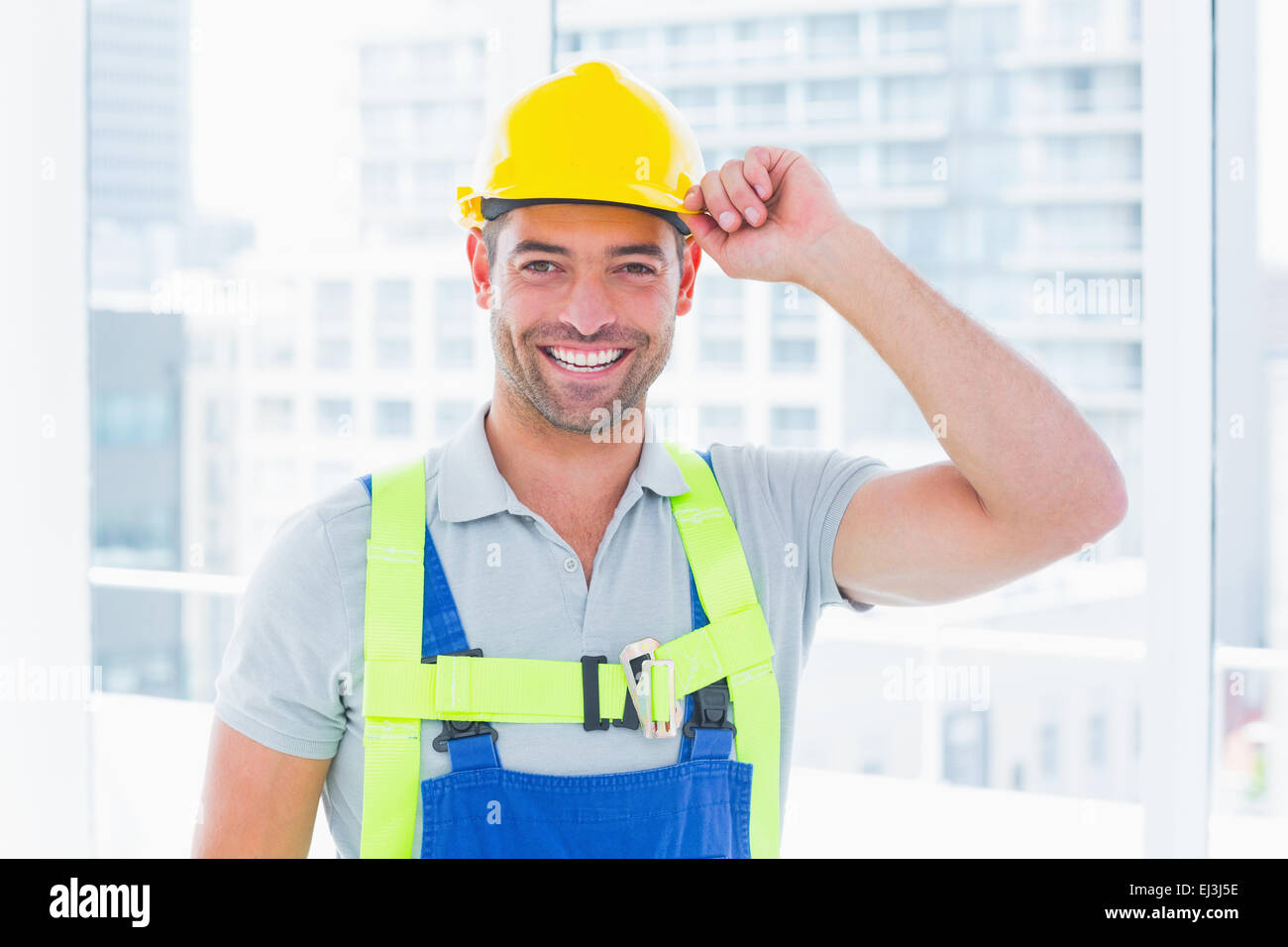 Worker wearing blue hat hi-res stock photography and images - Alamy