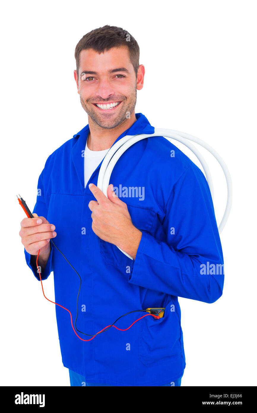 Smiling electrician with wire roll and multimeter Stock Photo - Alamy