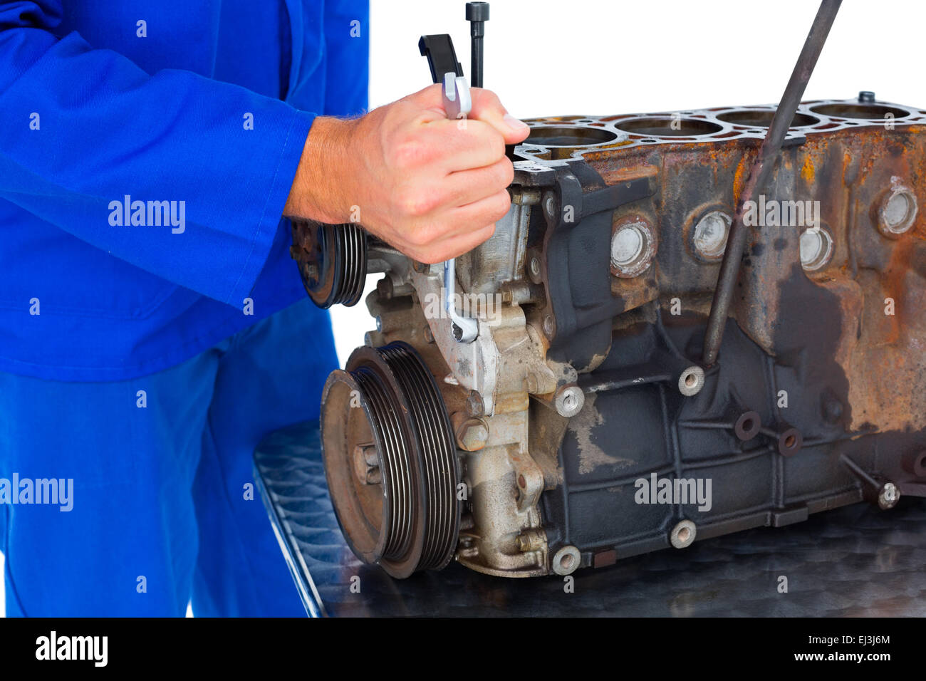 Male mechanic repairing car engine Stock Photo - Alamy