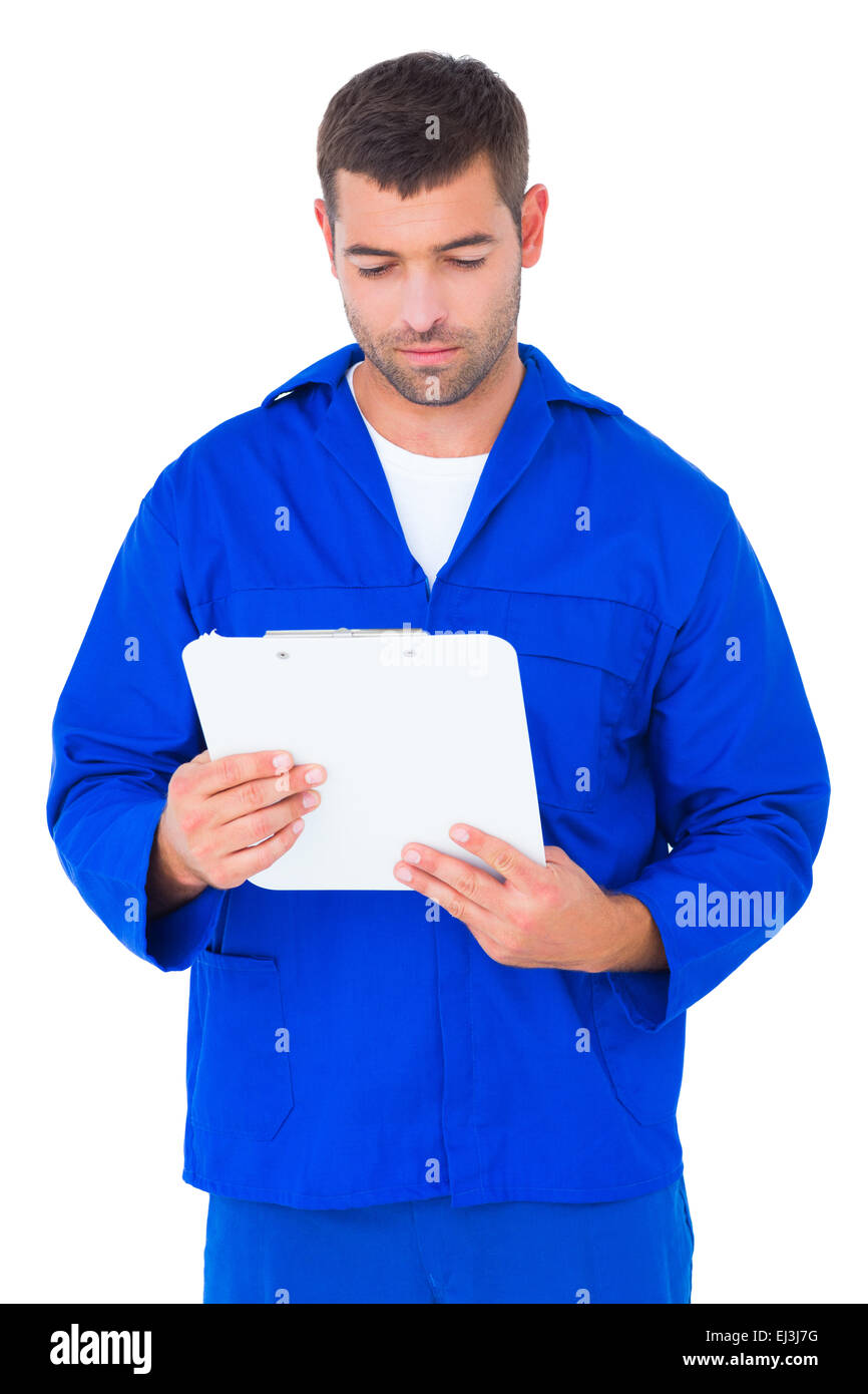 Mechanic reading clipboard Stock Photo - Alamy