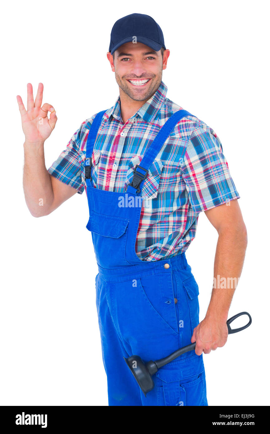 Portrait of happy plumber with plunger gesturing okay Stock Photo - Alamy
