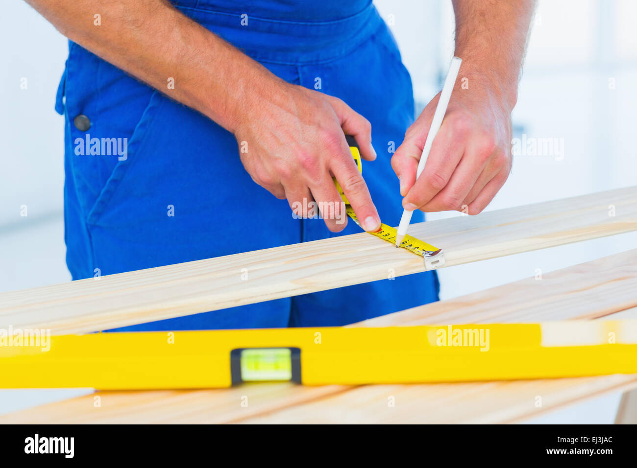 Worker marking measurement on hi-res stock photography and images - Alamy