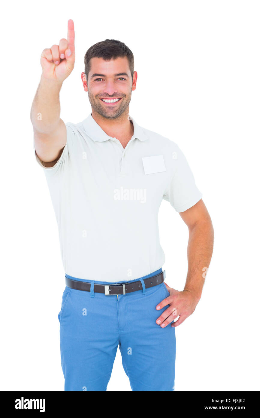 Male technician pointing upward on white background Stock Photo - Alamy