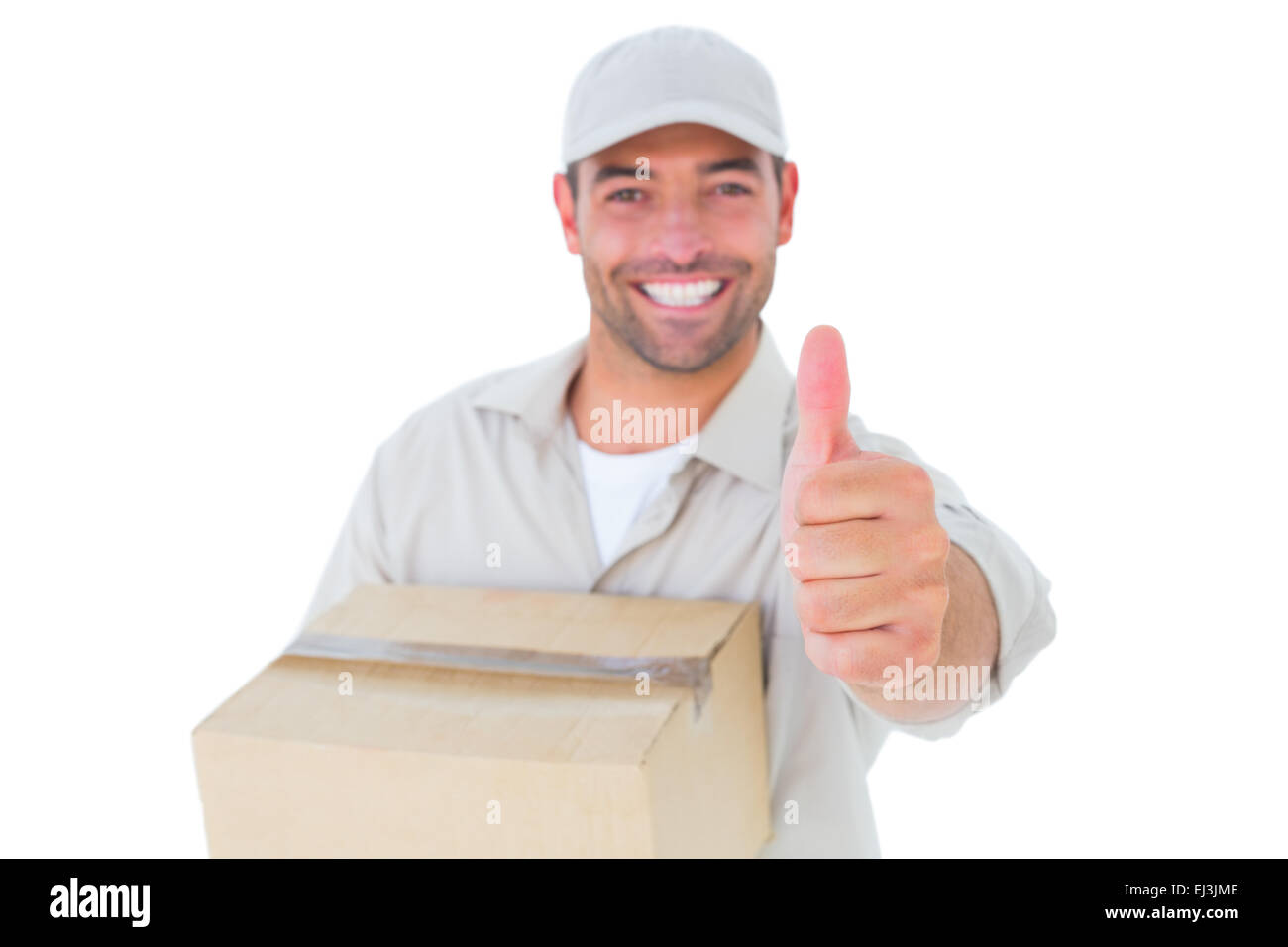 Delivery man with cardboard box gesturing thumbs up Stock Photo - Alamy