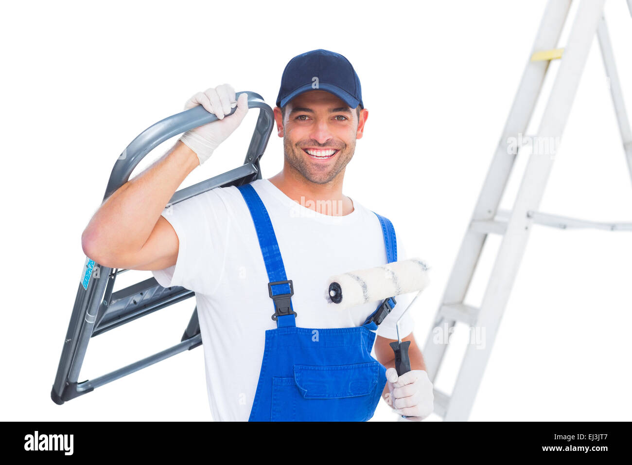 Happy handyman with chair and paint roller on white background Stock ...