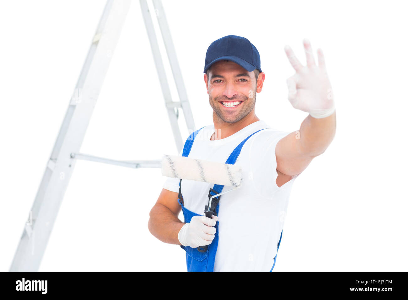 Positive handyman standing paint hi-res stock photography and images ...