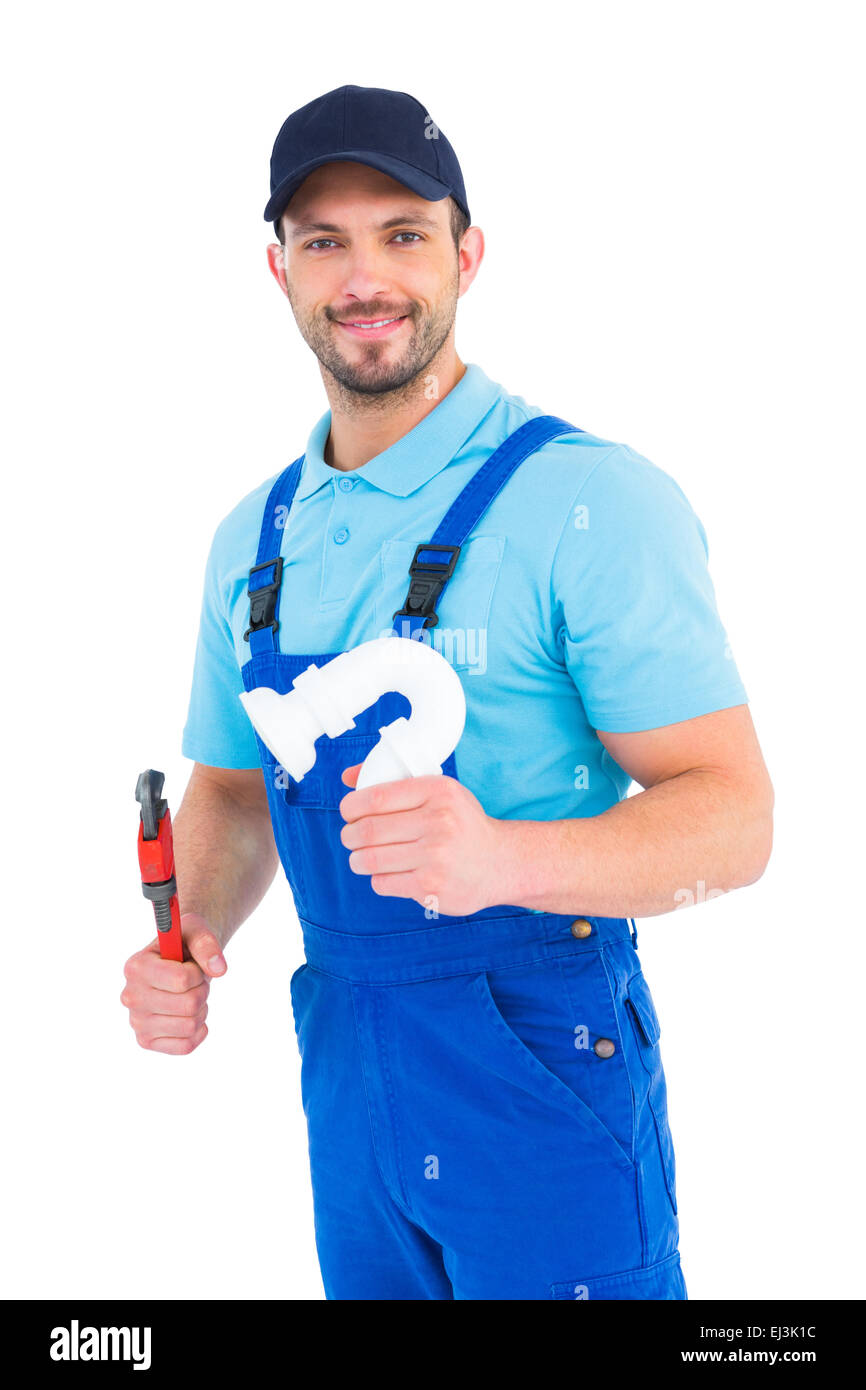 Handsome male plumber holding sink pipe Stock Photo - Alamy