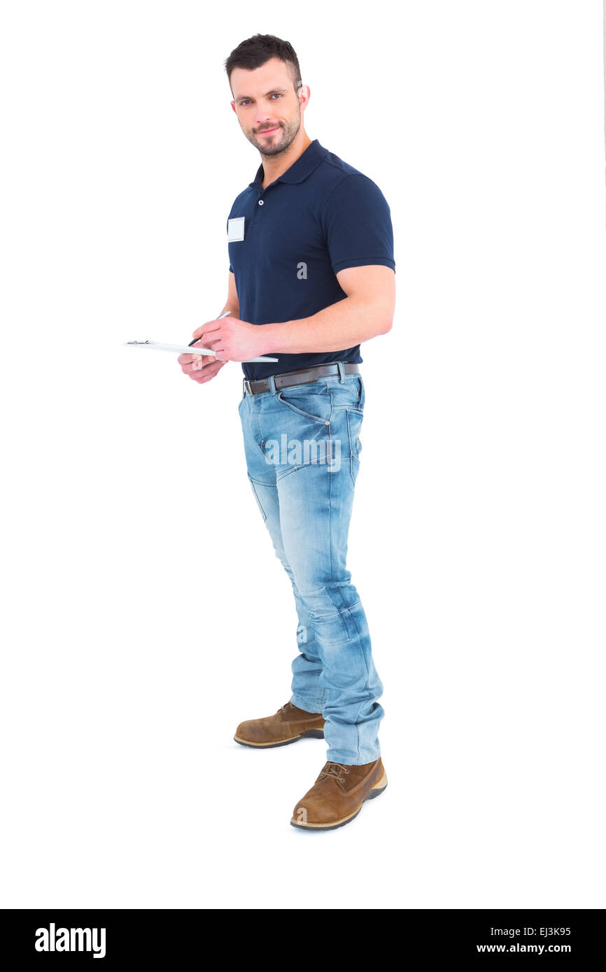 Male supervisor writing on clipboard Stock Photo - Alamy