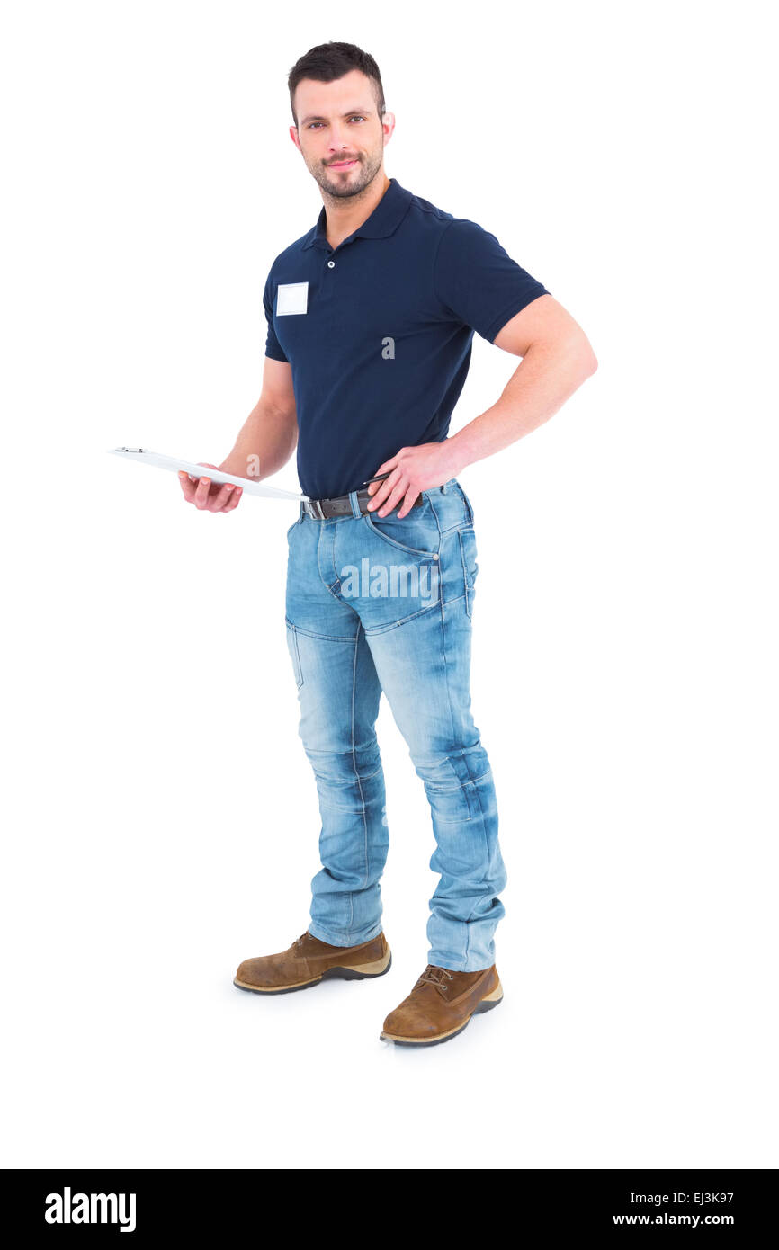 Male supervisor writing on clipboard Stock Photo - Alamy