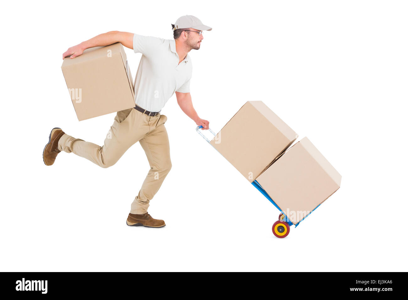 Delivery man with trolley of boxes running Stock Photo - Alamy
