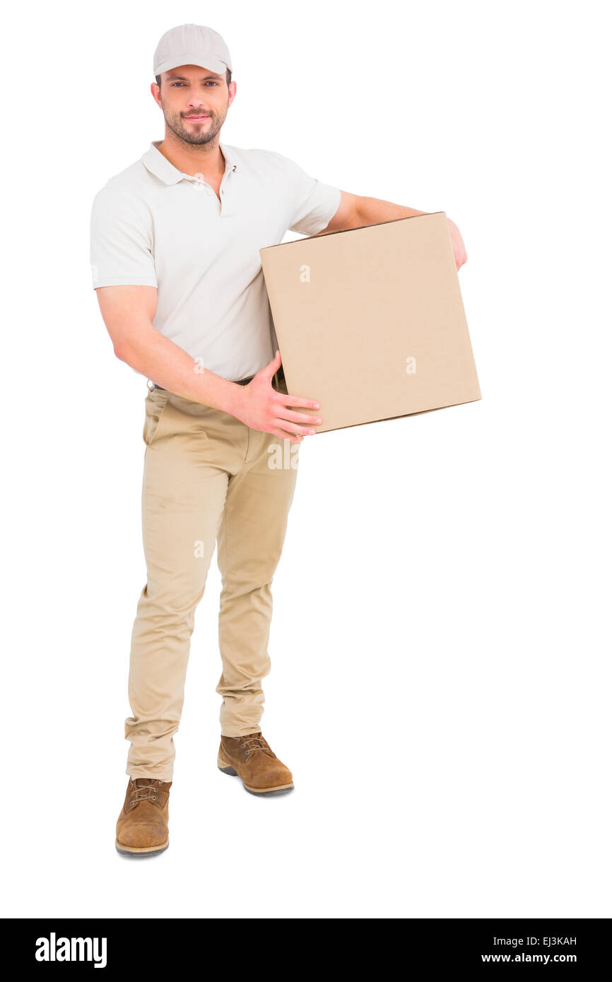 Delivery man carrying cardboard box Stock Photo - Alamy