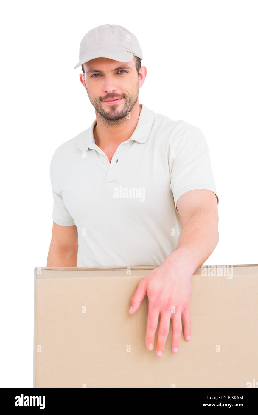 Delivery man carrying package Stock Photo - Alamy