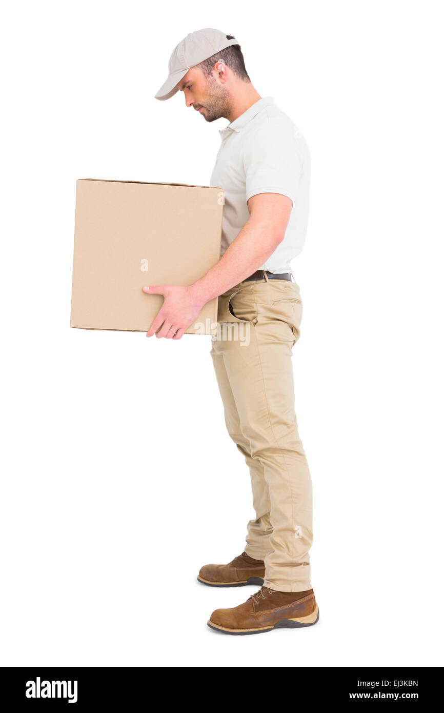 Delivery man carrying package Stock Photo - Alamy