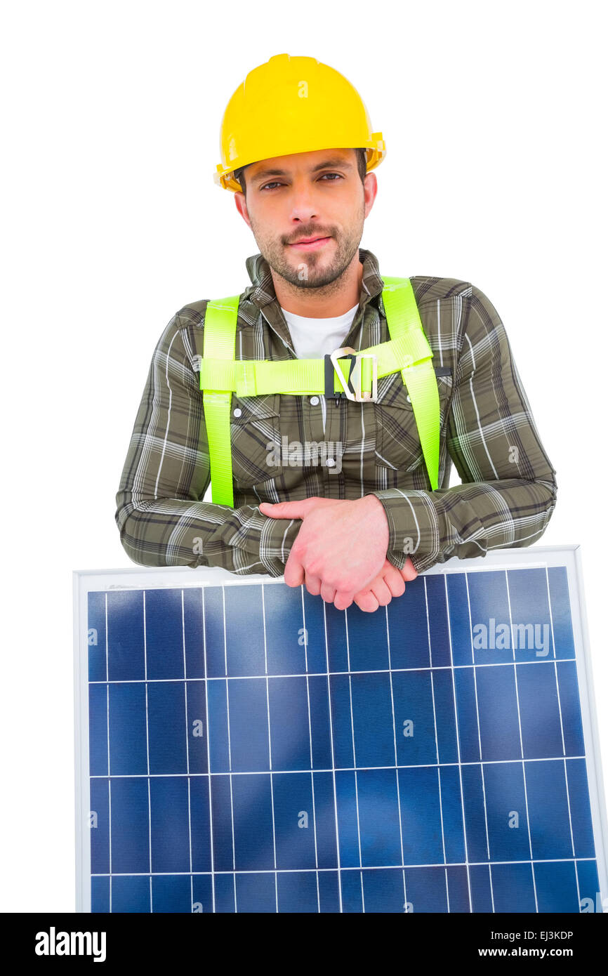 Manual worker with solar panel Stock Photo - Alamy