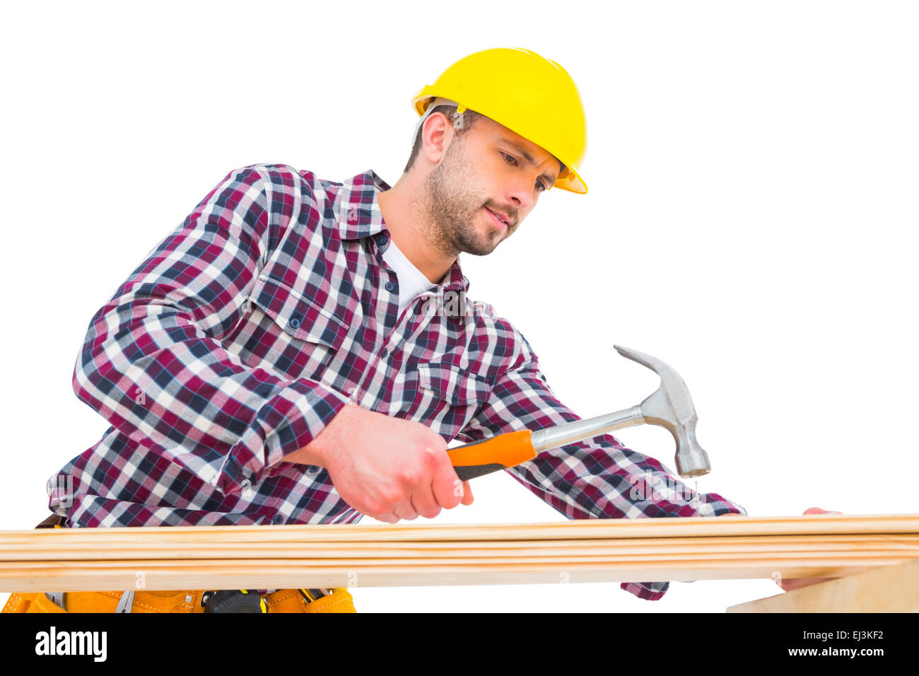 Handyman using hammer on wood Stock Photo - Alamy