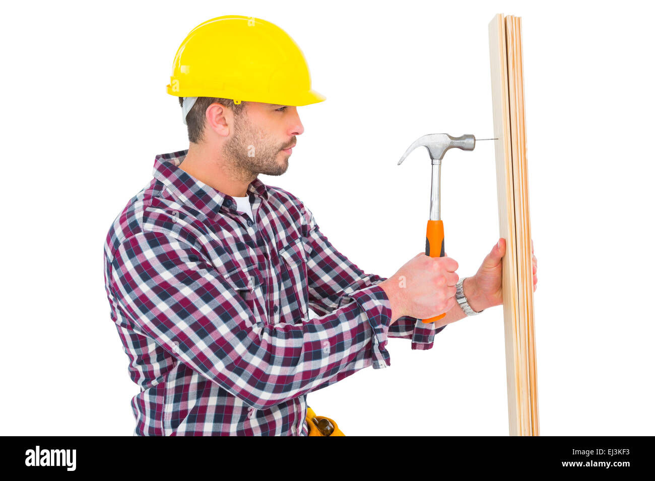 Handyman using hammer on wood Stock Photo - Alamy