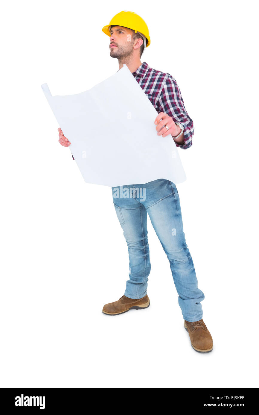 Thoughtful architect holding blueprint Stock Photo - Alamy