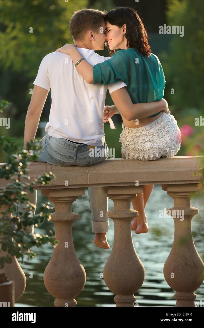 Sitting man and woman Stock Photo - Alamy