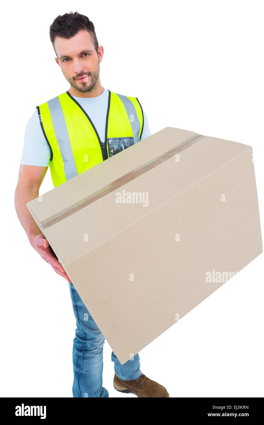 Delivery man holding cardboard box Stock Photo - Alamy