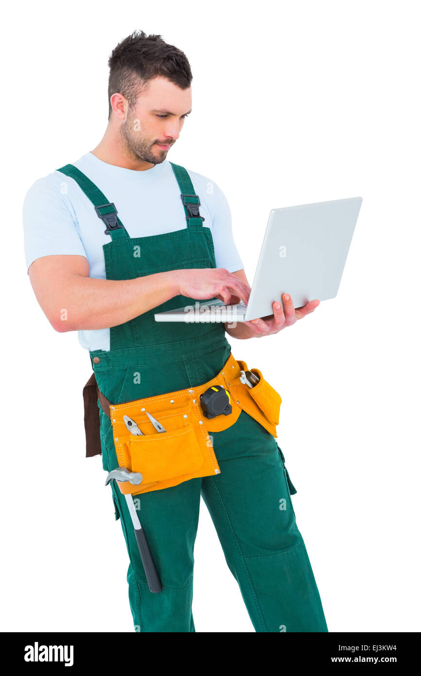 Construction worker holding laptop Stock Photo - Alamy