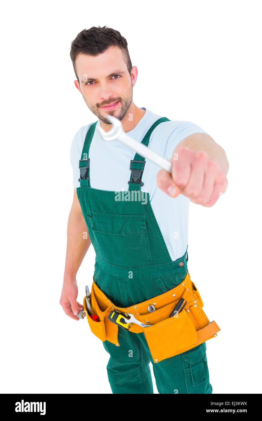 Carpenter showing wrench Stock Photo - Alamy