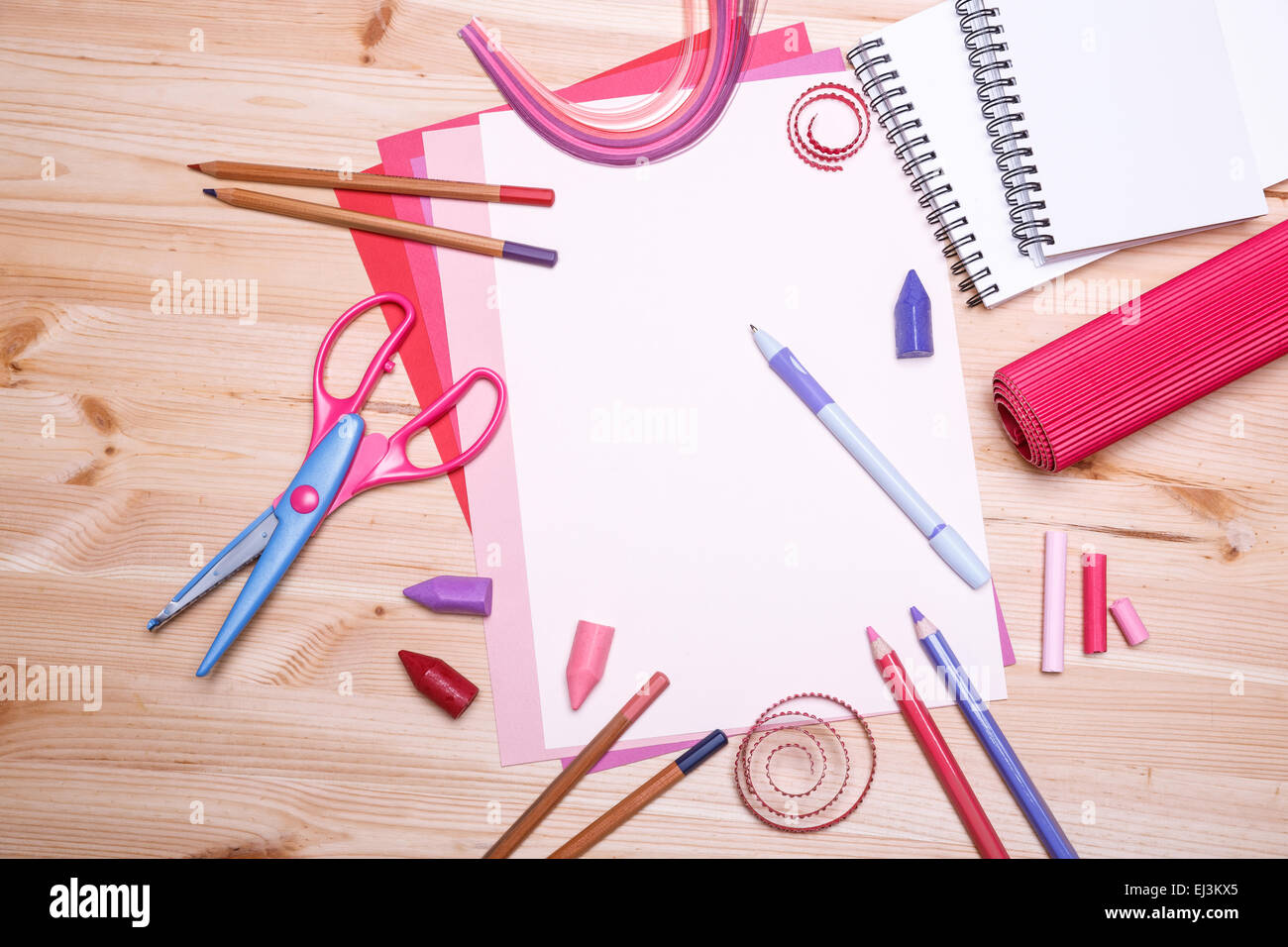 various drawing tools - pink and purple paper and pencils and other ...