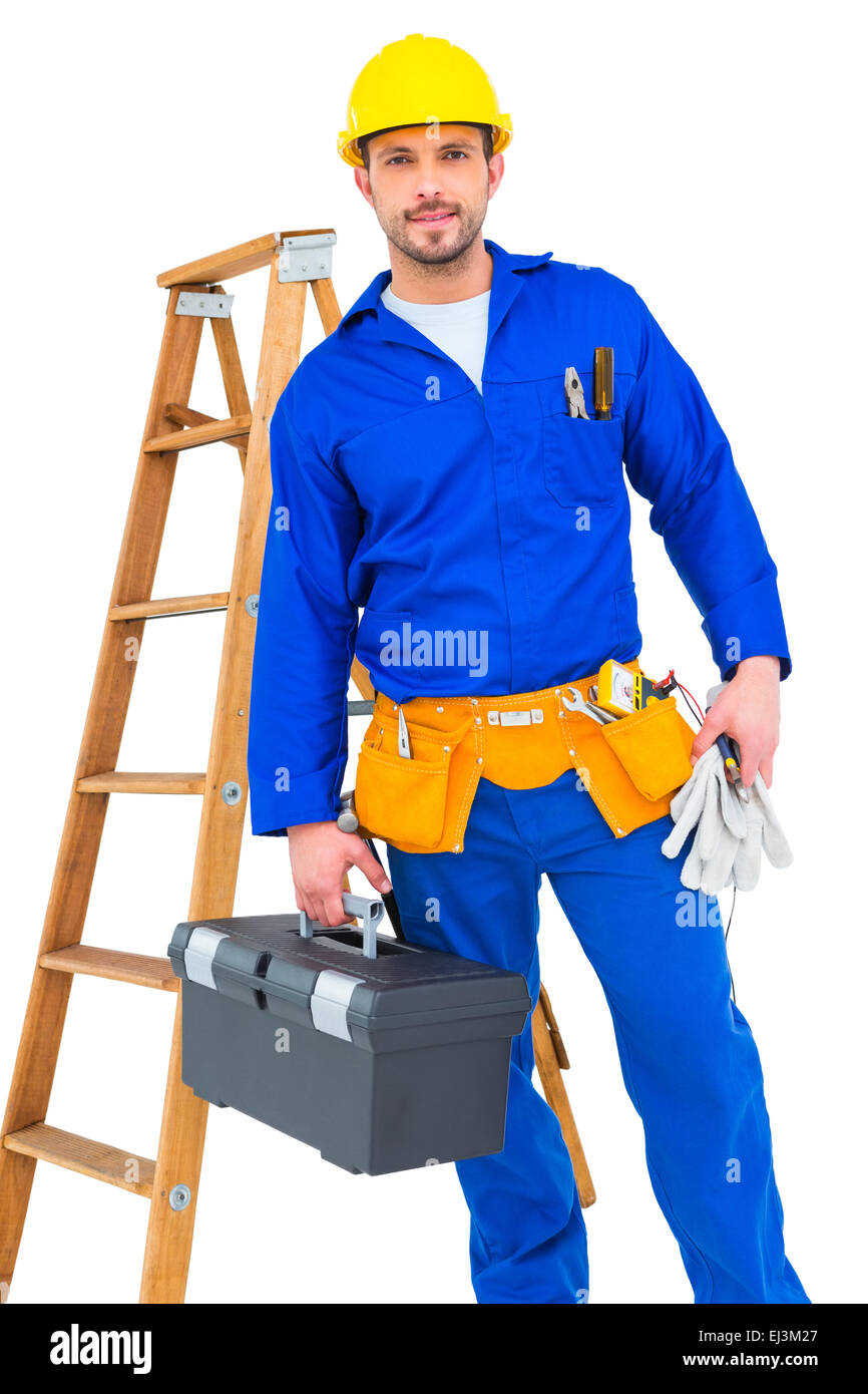 Smiling handyman holding tool box Stock Photo - Alamy