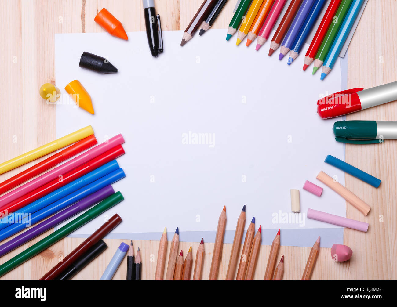 various drawing tools - white paper, pencils and markers and other of ...