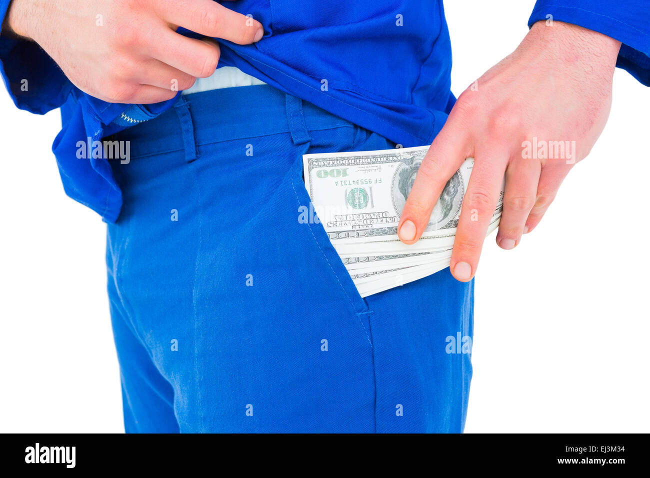 Handyman putting money in his pocket Stock Photo - Alamy