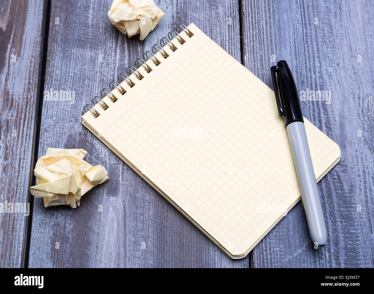 yellow notebook in a cage with question mark and black marker and ...