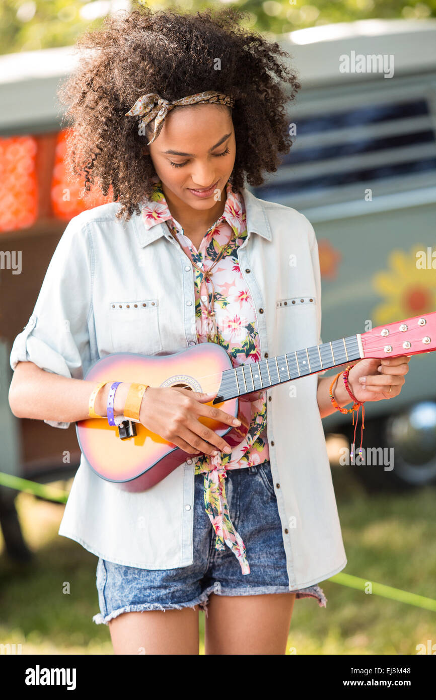 Playing the ukulele hi-res stock photography and images - Alamy