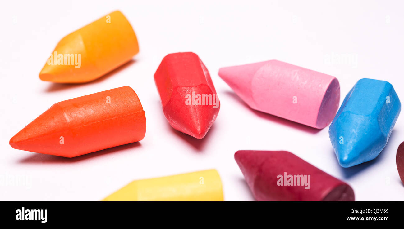 many colorful crayons scattered on a white background Stock Photo - Alamy