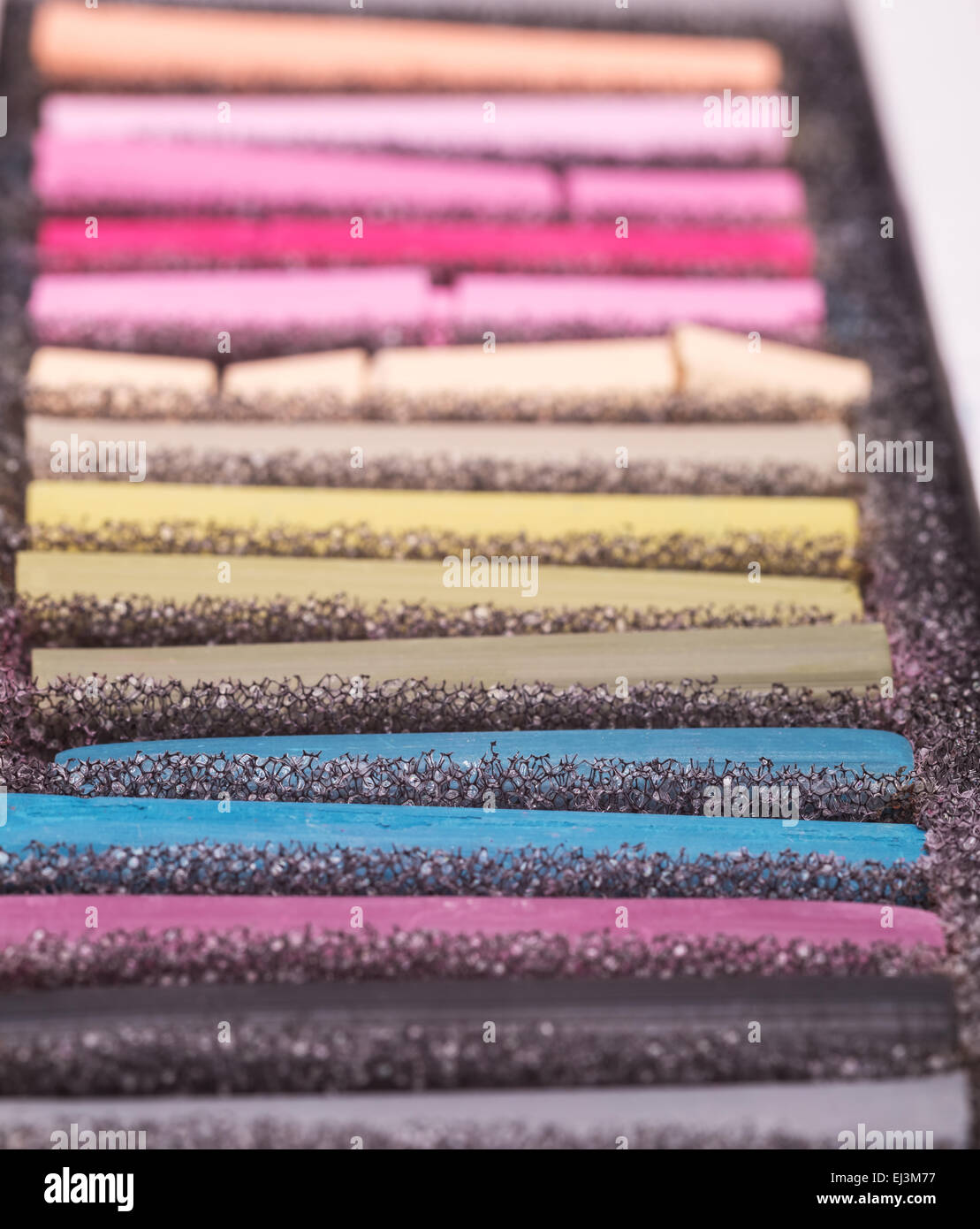 many colorful pastel chalks in a special box on white background Stock ...
