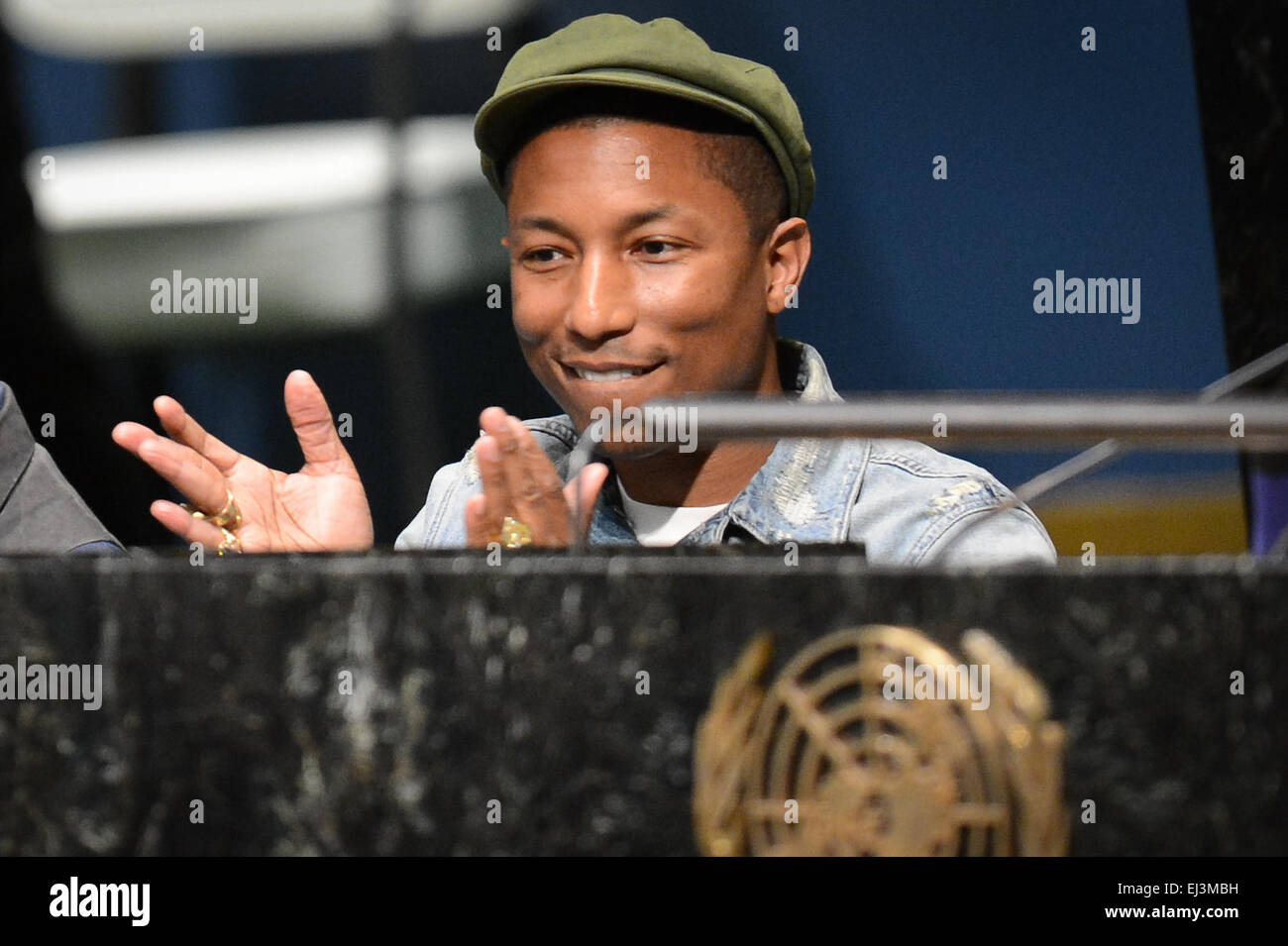 New York, USA. 20th Mar, 2015. Singer Pharrell Williams applauds during ...