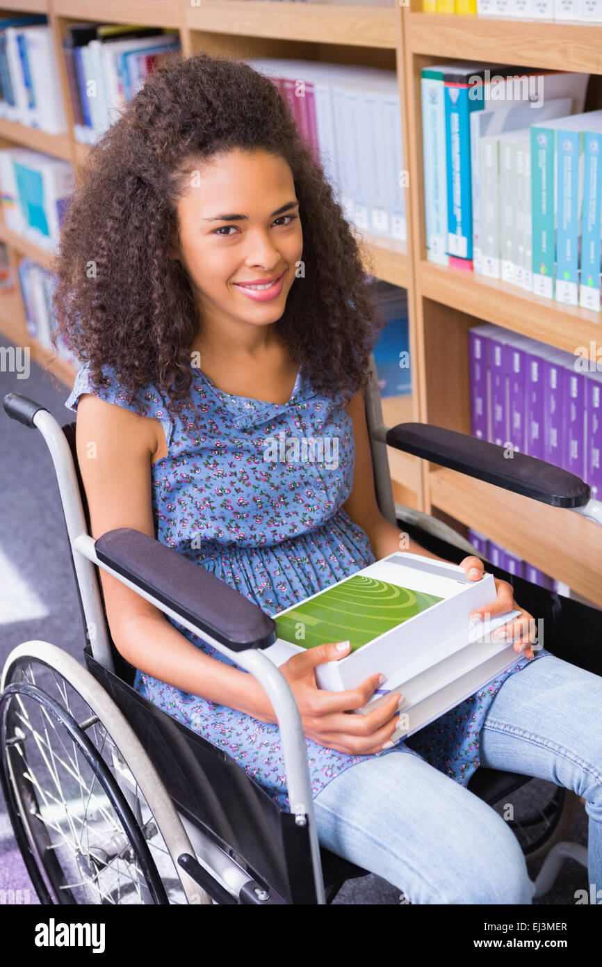Smiling disabled student in library Stock Photo - Alamy