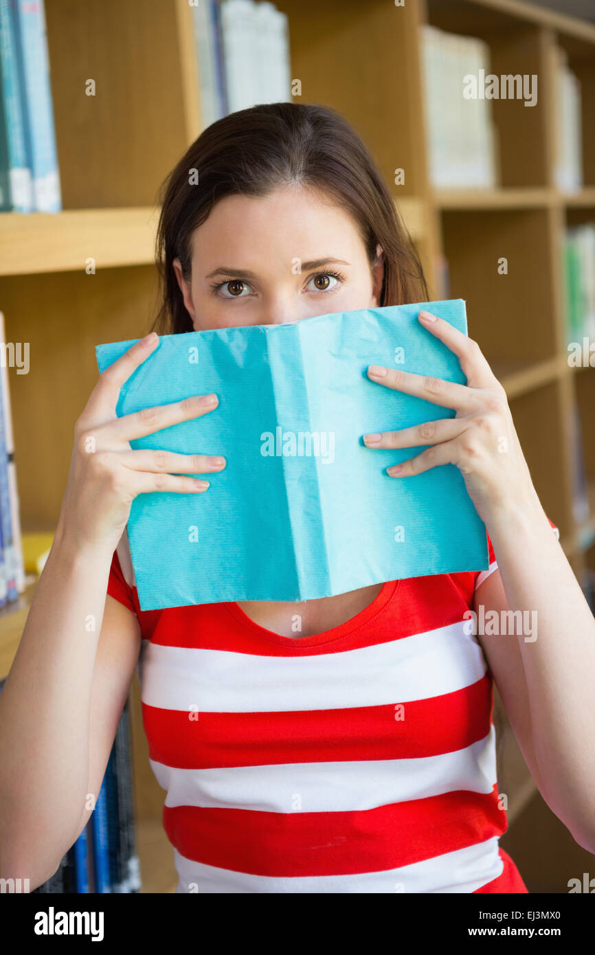 Student covering face book in hi-res stock photography and images - Alamy