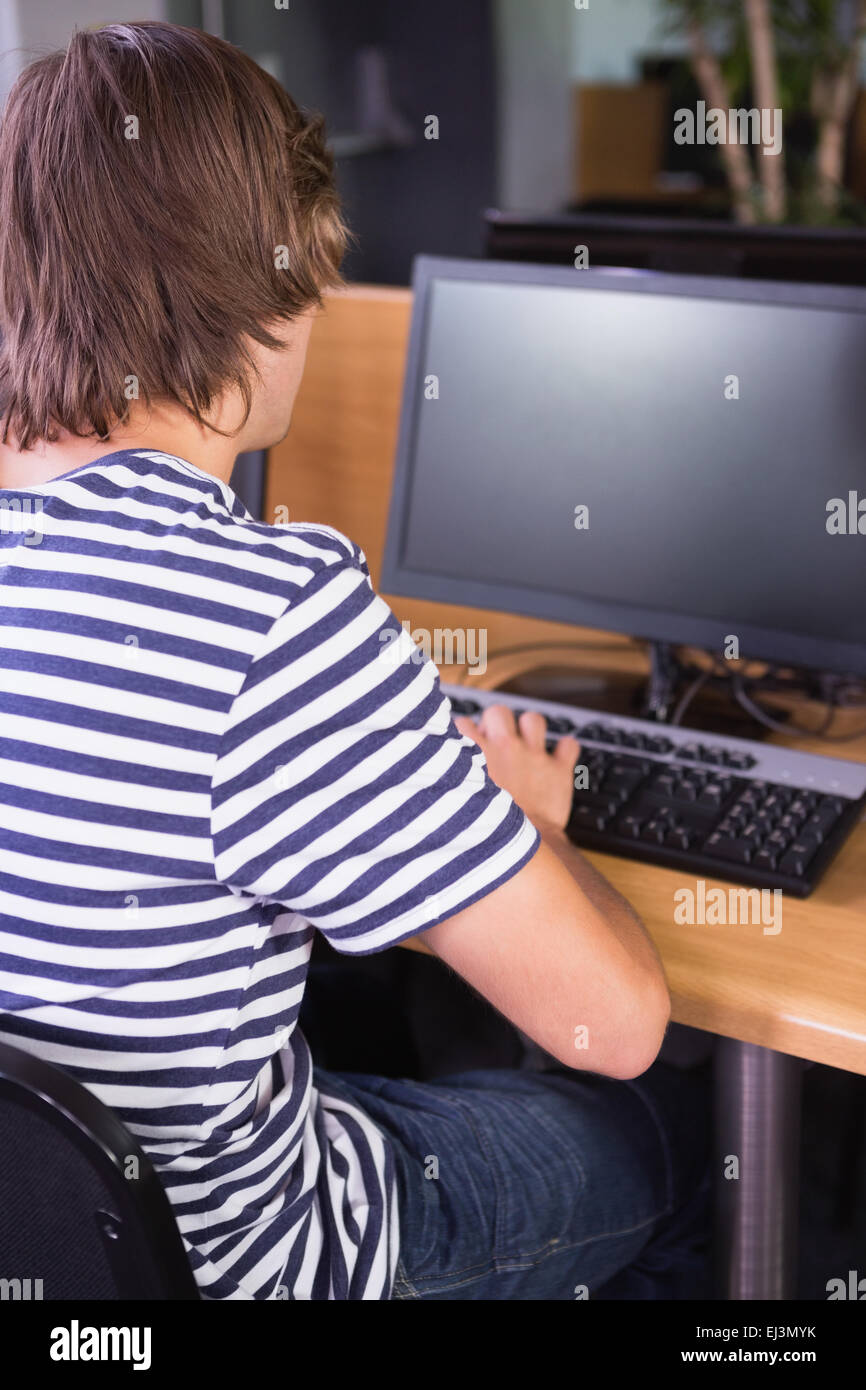 Student using computer in classroom Stock Photo - Alamy
