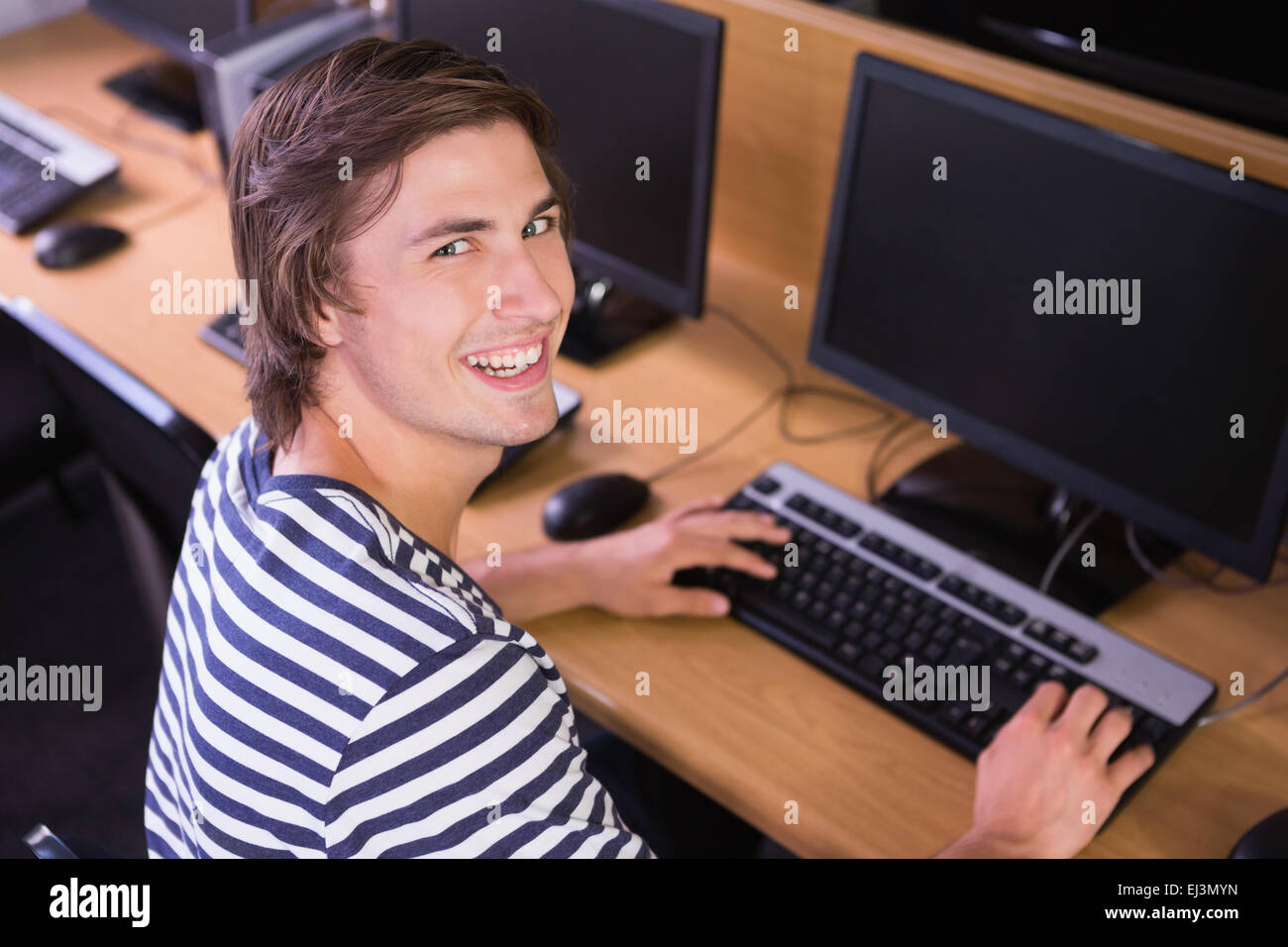 Student using computer in classroom Stock Photo - Alamy