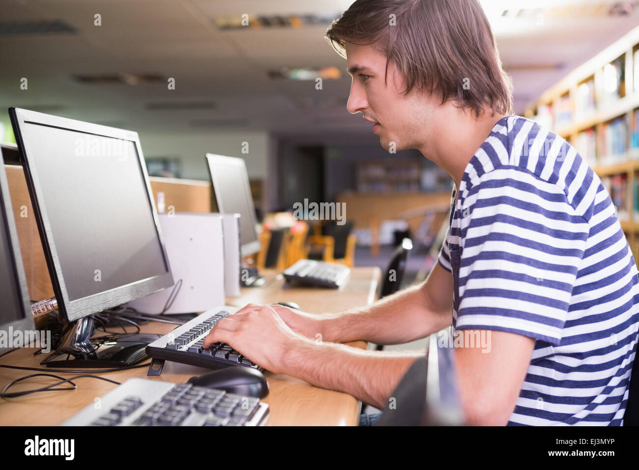 Student using computer in classroom Stock Photo - Alamy