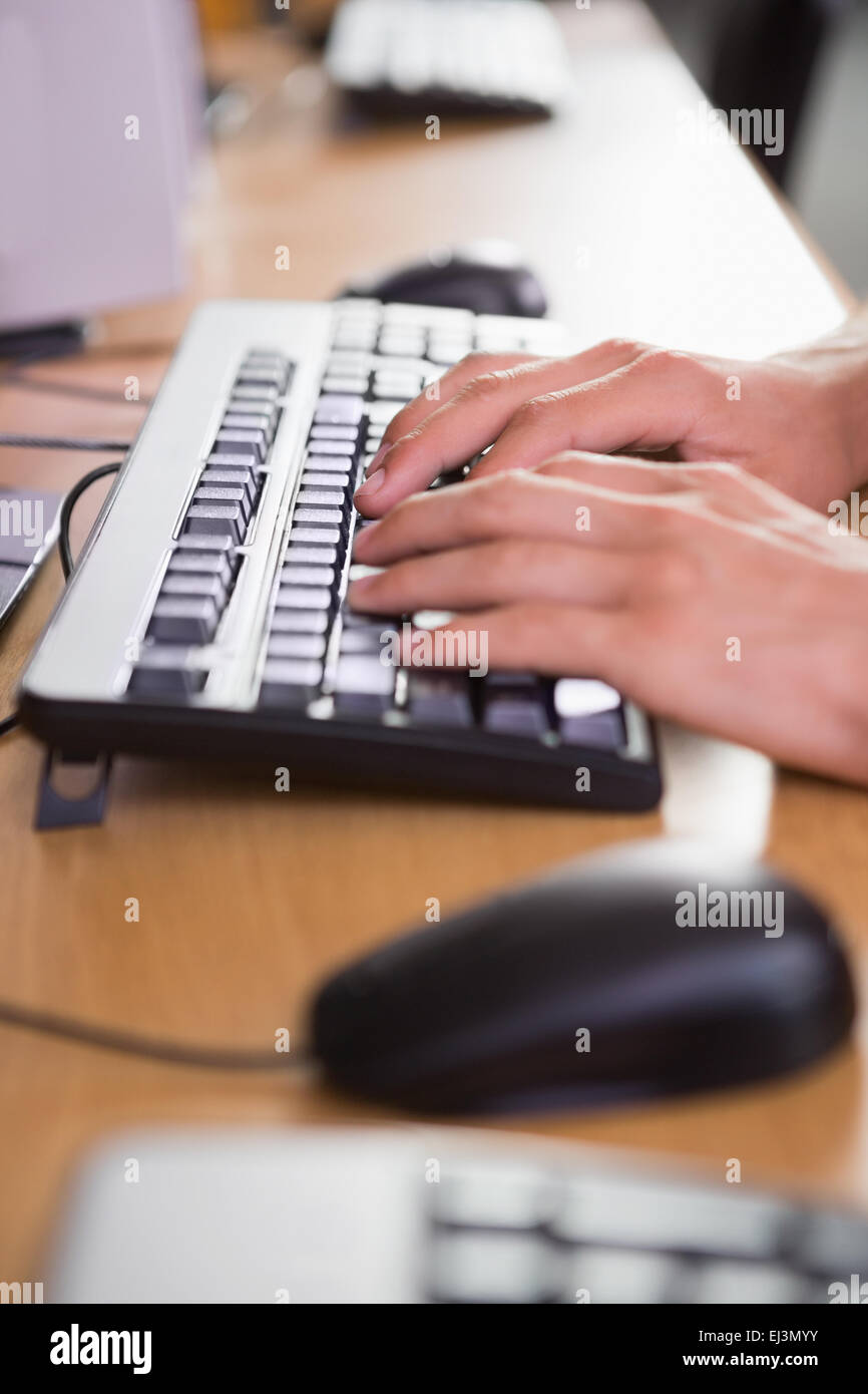 Student using computer in classroom Stock Photo - Alamy