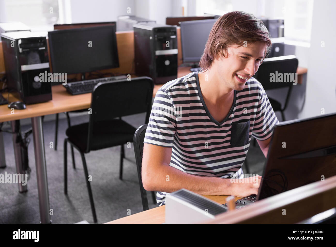 Student using computer in classroom Stock Photo - Alamy