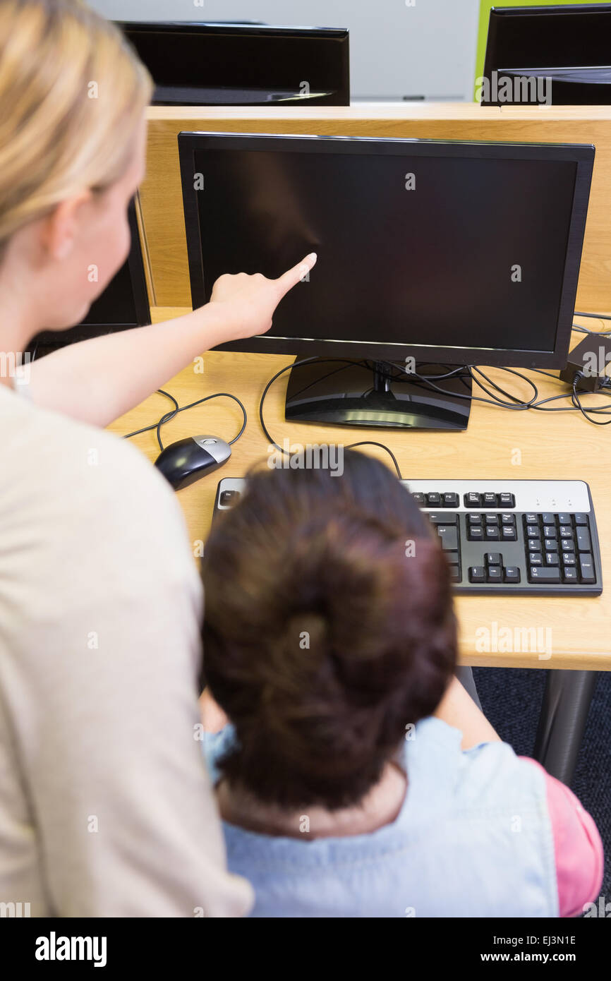 Students working on computer together Stock Photo - Alamy