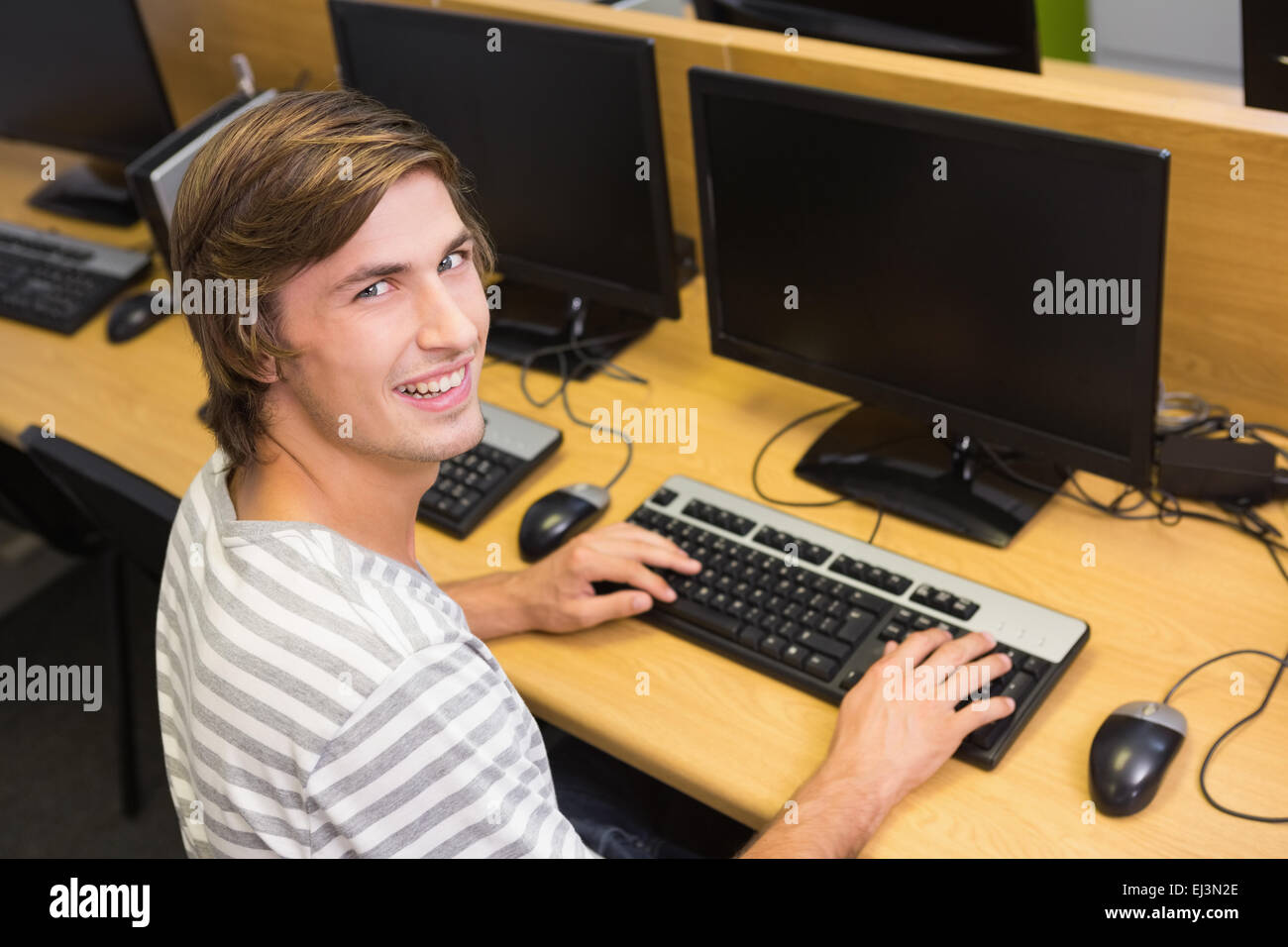 Student working on computer in classroom Stock Photo - Alamy